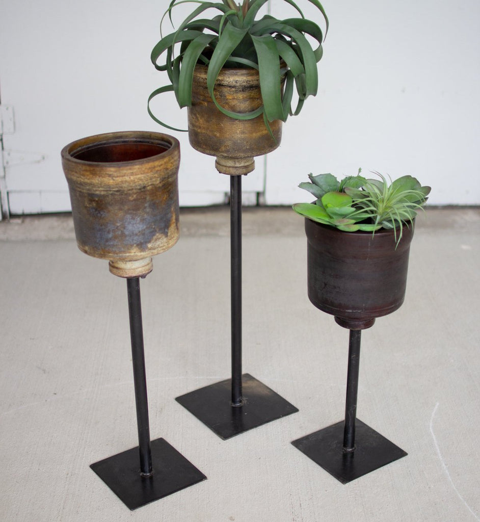 Repurposed Fiberglass Planters with Iron Stands – E.T. Tobey Company